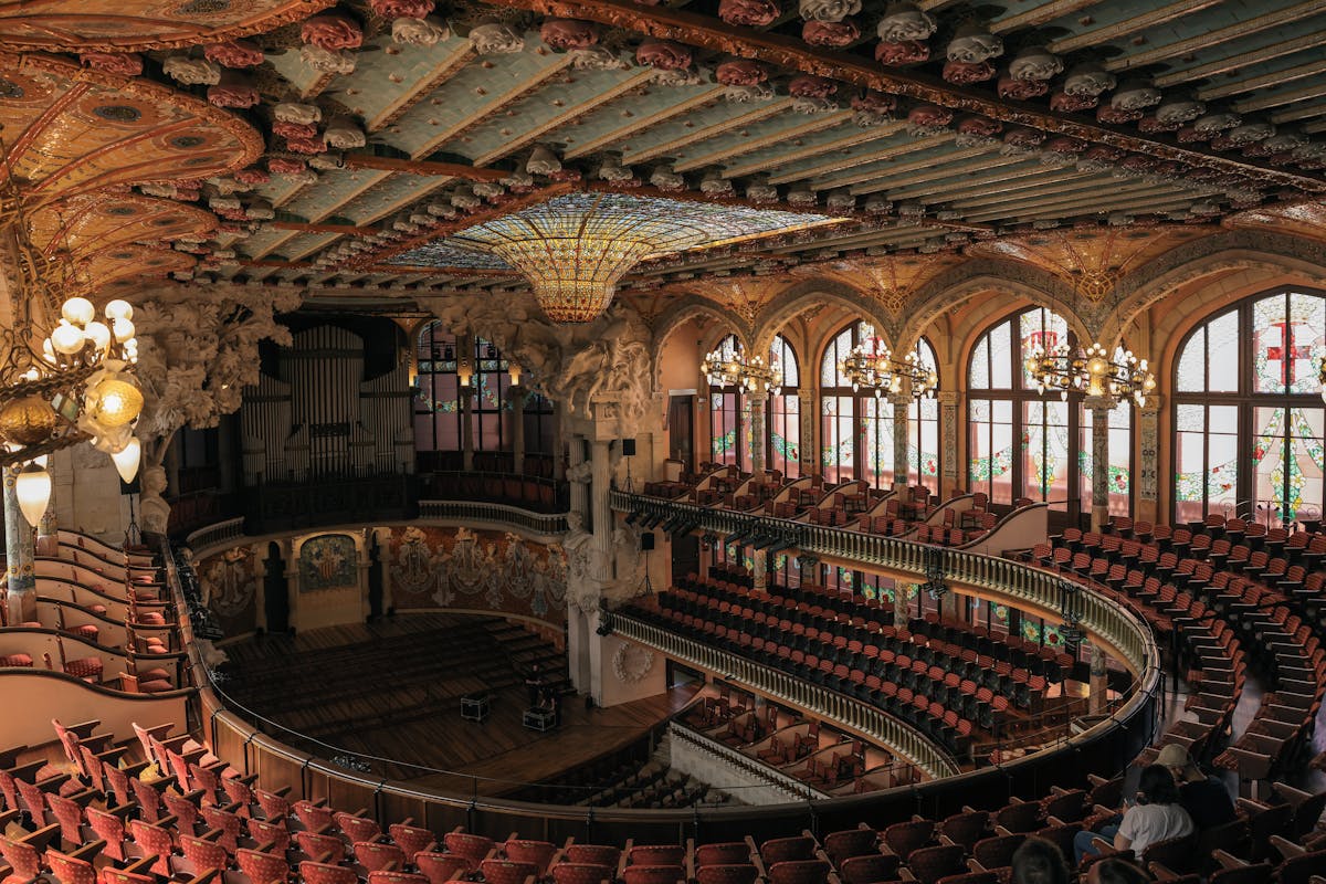 Stunning interior architecture of Palau de la Musica Catalana with ornate columns and arches