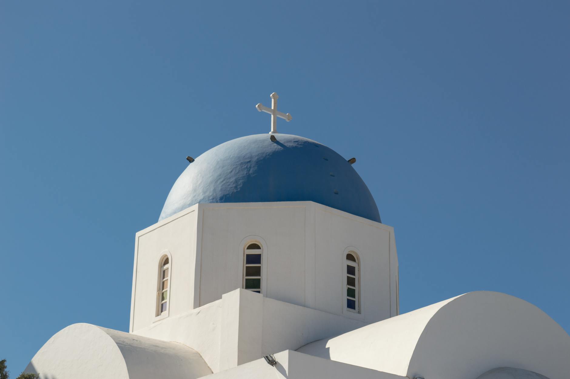 Church dome and rooftops against a blue sky in the Mediterranean