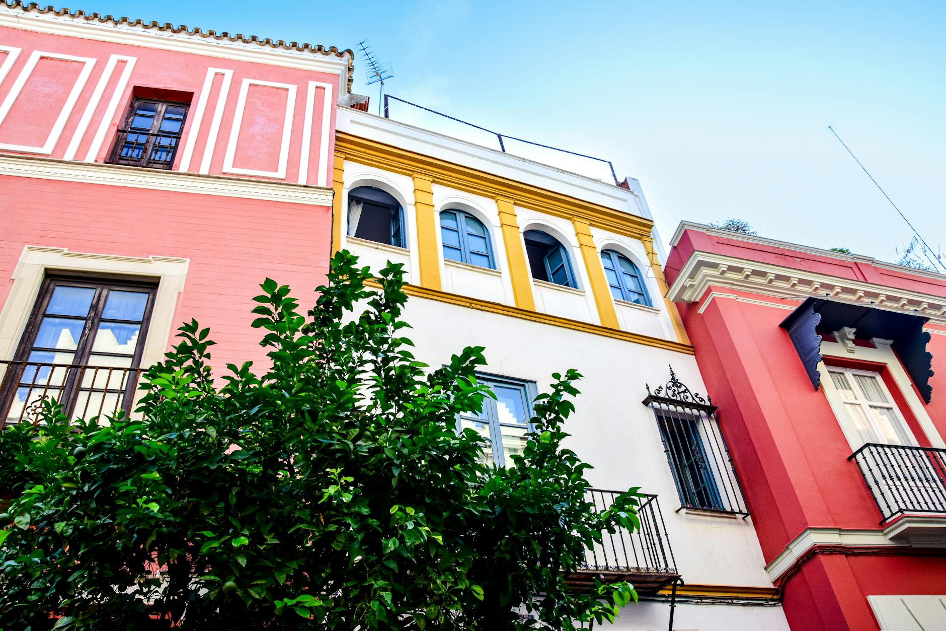 Colorful buildings lining a narrow street in a Mediterranean city