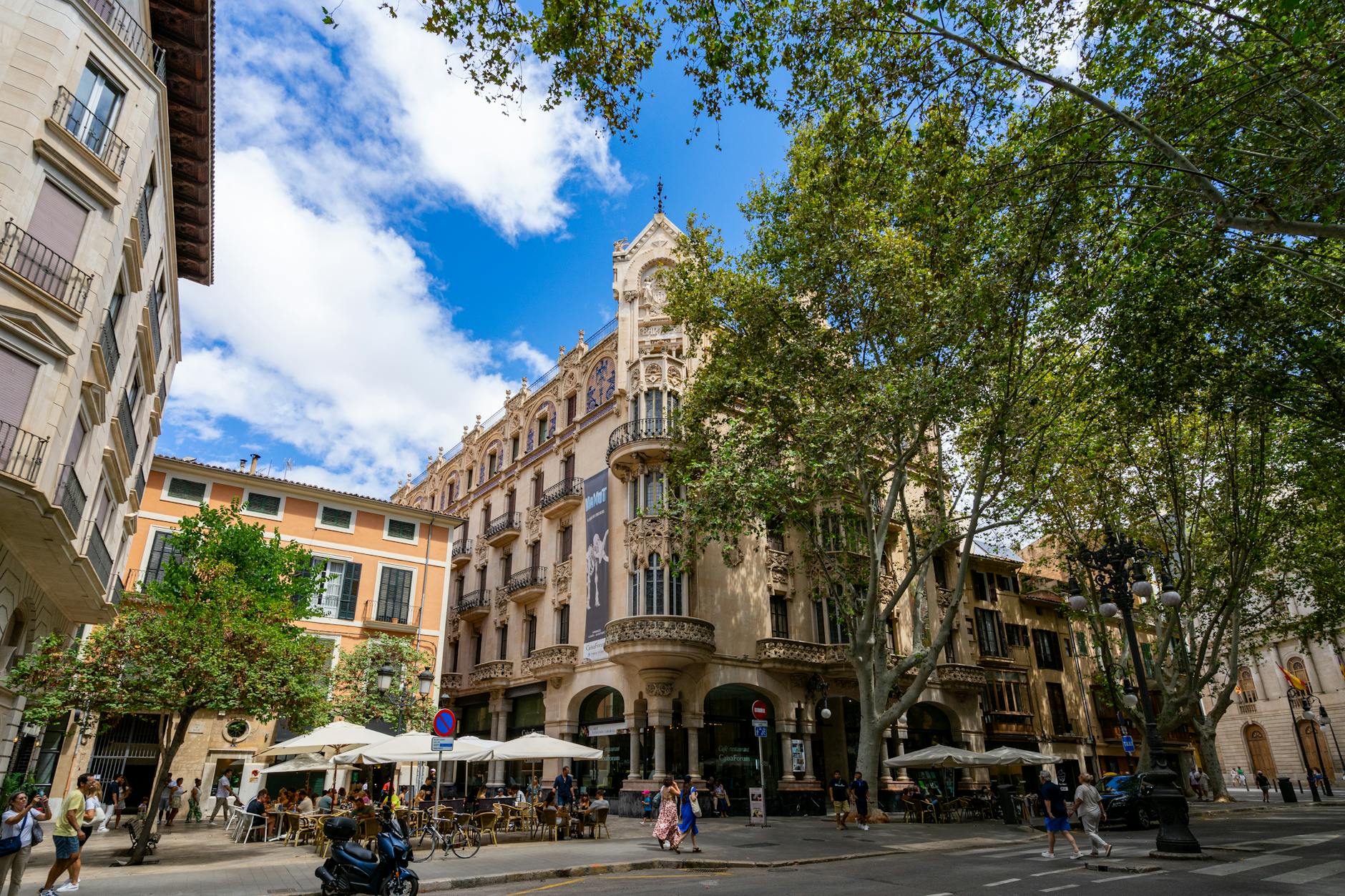 Narrow historic street in Palma de Mallorca old town with stone buildings