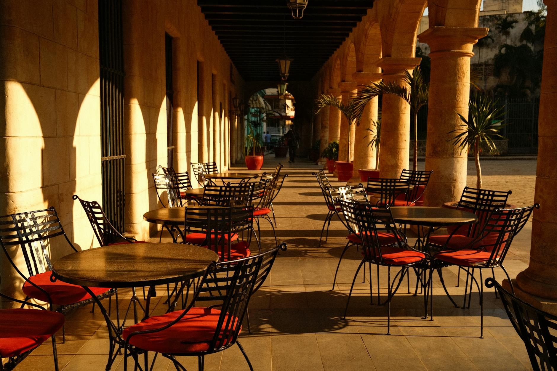 Outdoor cafe terrace on a Mediterranean street with diners