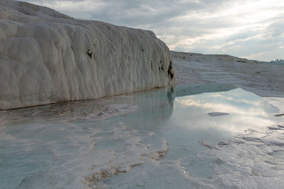 Hierapolis sits directly above the travertines, which is the part most day trippers skip and regret later.