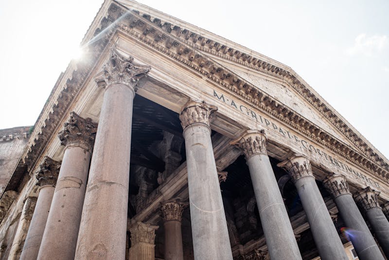 Looking up at the Pantheon facade showing the Latin inscription M AGRIPPA