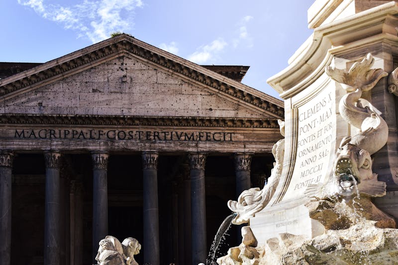 Close-up of the Fontana del Pantheon with the Pantheon building in the background