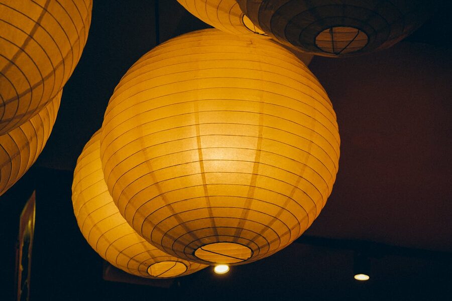 Warm paper lanterns creating a cozy atmosphere with soft ambient lighting indoors