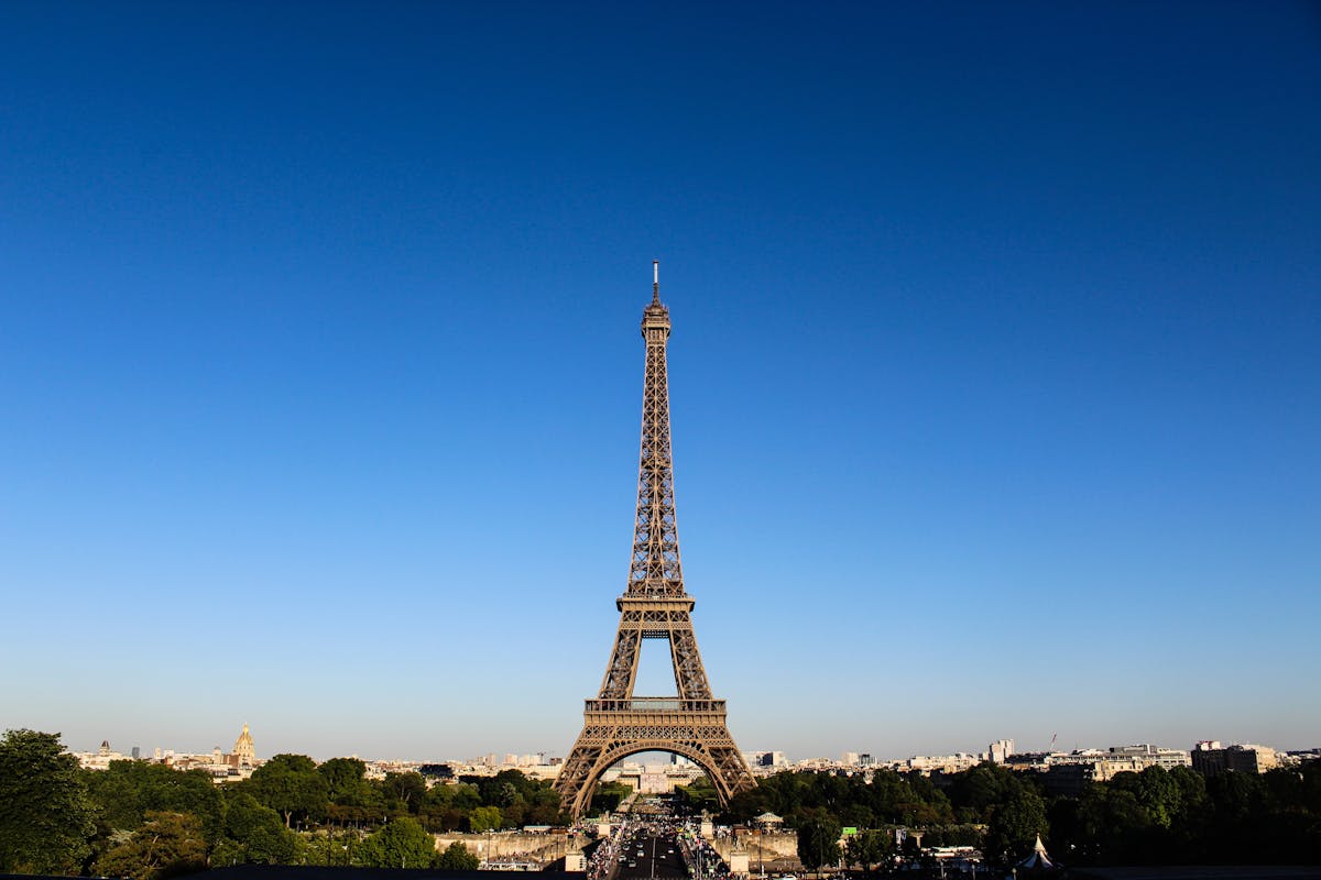 View of the Eiffel Tower and Paris skyline at dusk