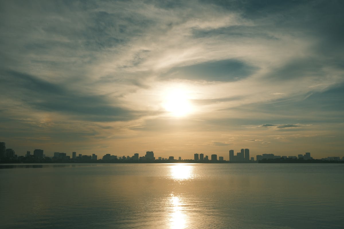 Beautiful sunset over the Paris skyline with calm reflections on the Seine in autumn