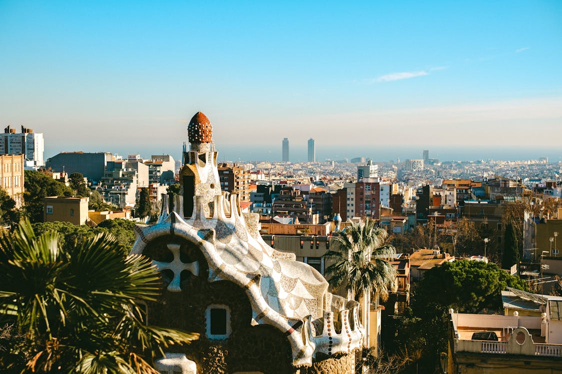 Aerial view of Park Guell showing Gaudi architecture with Barcelona cityscape
