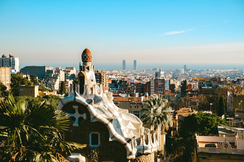 Aerial view of Park Guell unique Gaudi architecture with Barcelona cityscape in background