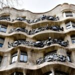 Full view of the wavy facade of Casa Mila La Pedrera a Gaudi masterpiece in Barcelona