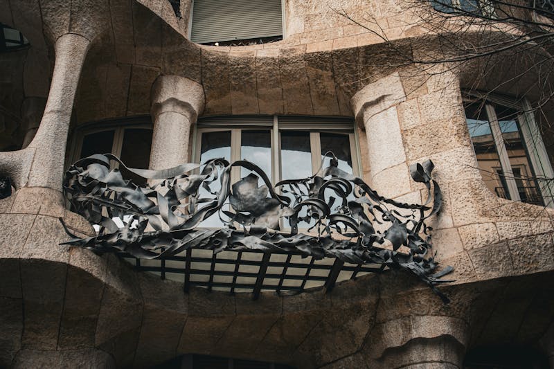 Artistic detail of Casa Mila iron balcony railing designed by Gaudi in Barcelona