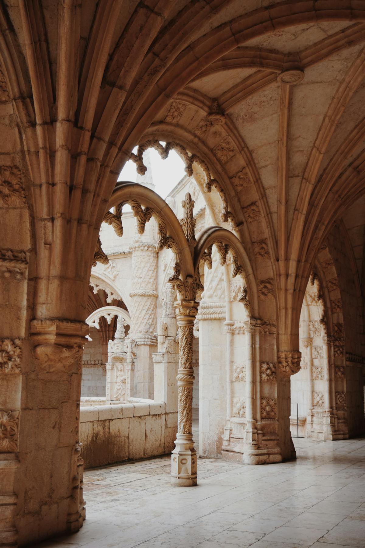 Stone arches and columns of a Lisbon monastery cloister