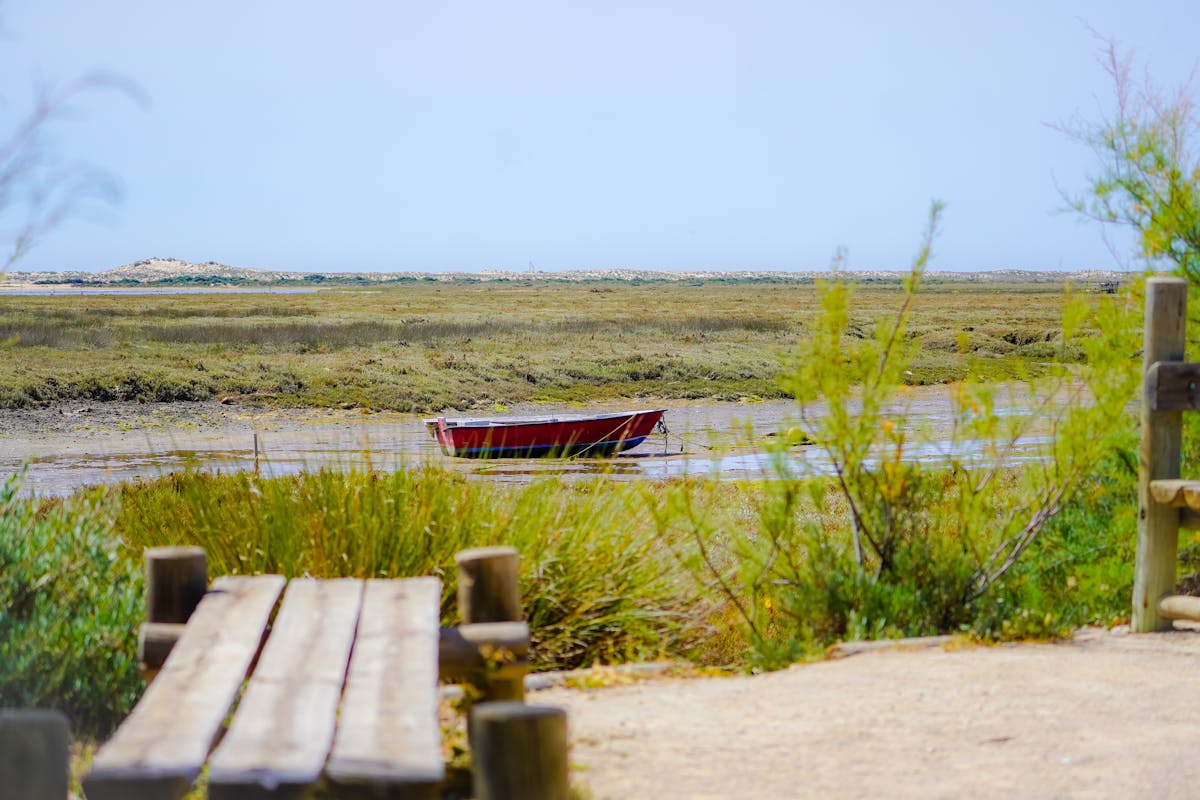 A wooden boat on the tidal flats near Fuseta Portugal