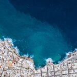 Aerial view of Polignano a Mare showing the clifftop town and turquoise Adriatic Sea