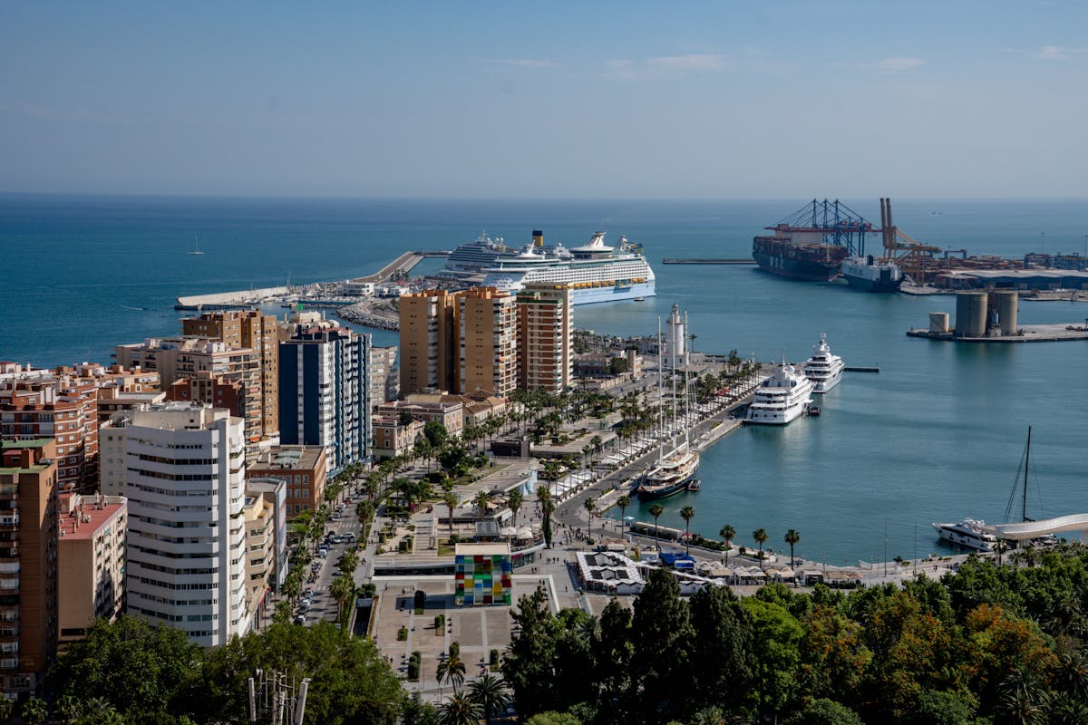 Breathtaking view of Malaga coastline and harbour with cruise ships and mountains