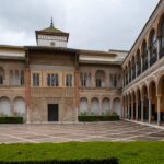 Courtyard with Moorish arches and decorative tilework in a Seville palace