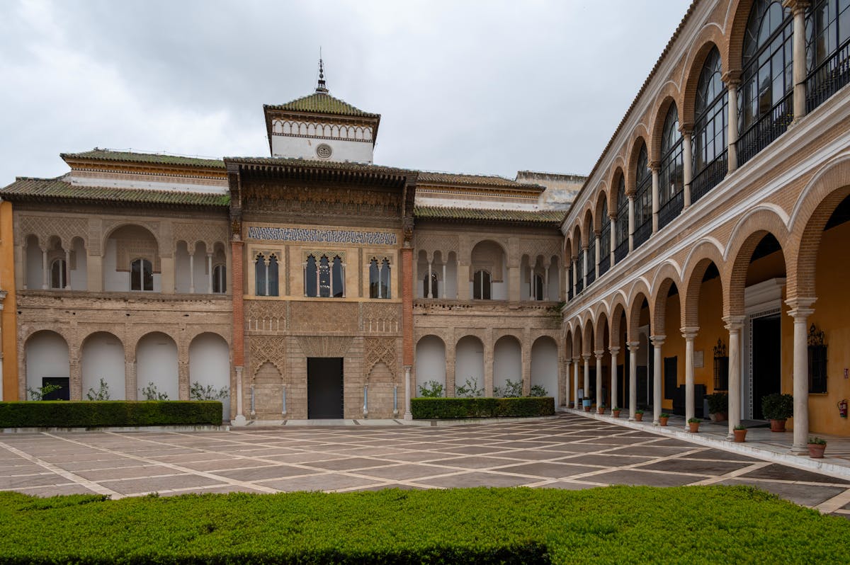 Courtyard with Moorish arches and decorative tilework in a Seville palace