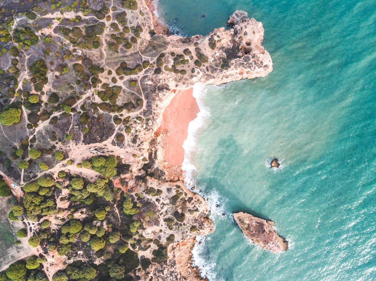 Stunning aerial shot of the Faro coastline showing sandy beaches and turquoise lagoon waters