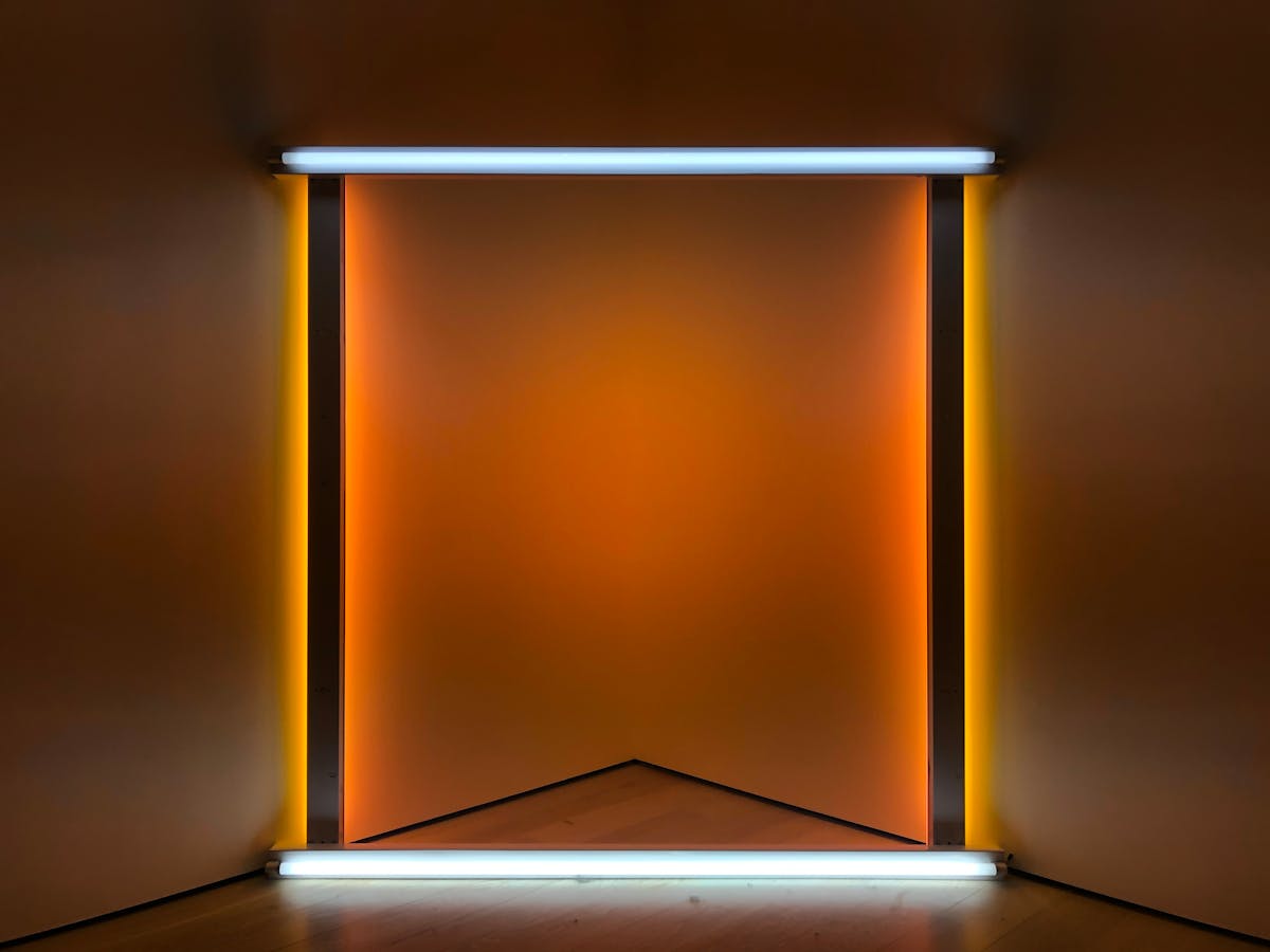 Abstract geometric art installation with bright neon lights creating colorful patterns