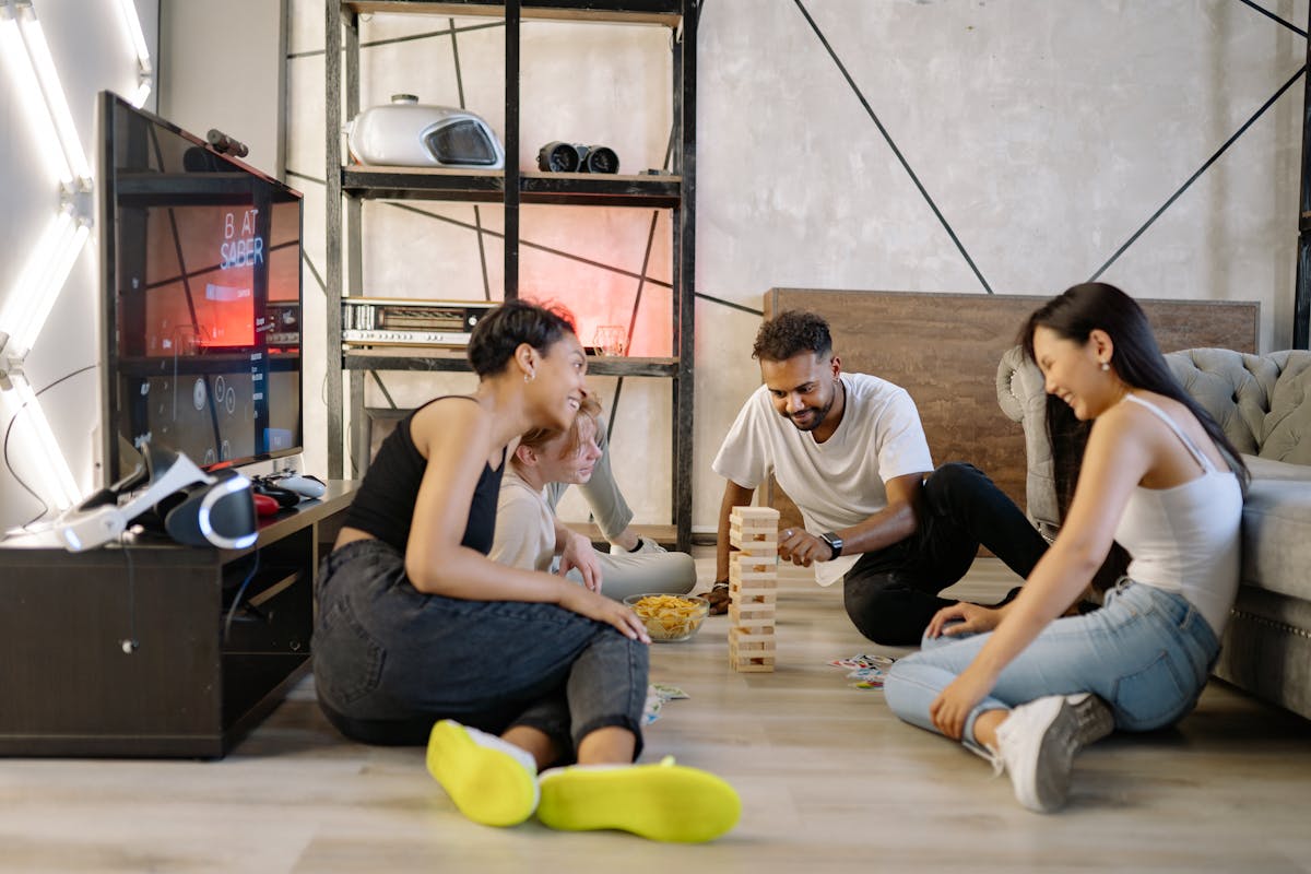 A group of diverse friends playing games and having fun indoors