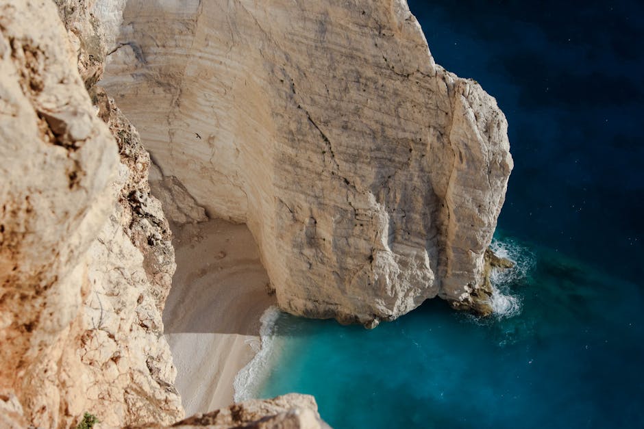 Aerial view of Navagio Beach's iconic cliff and turquoise waters