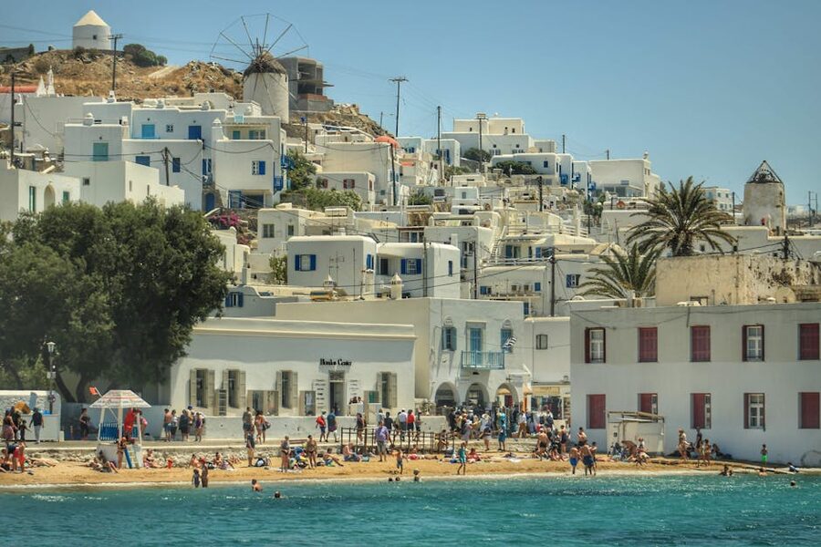 Sunlit Mykonos beach with iconic white architecture