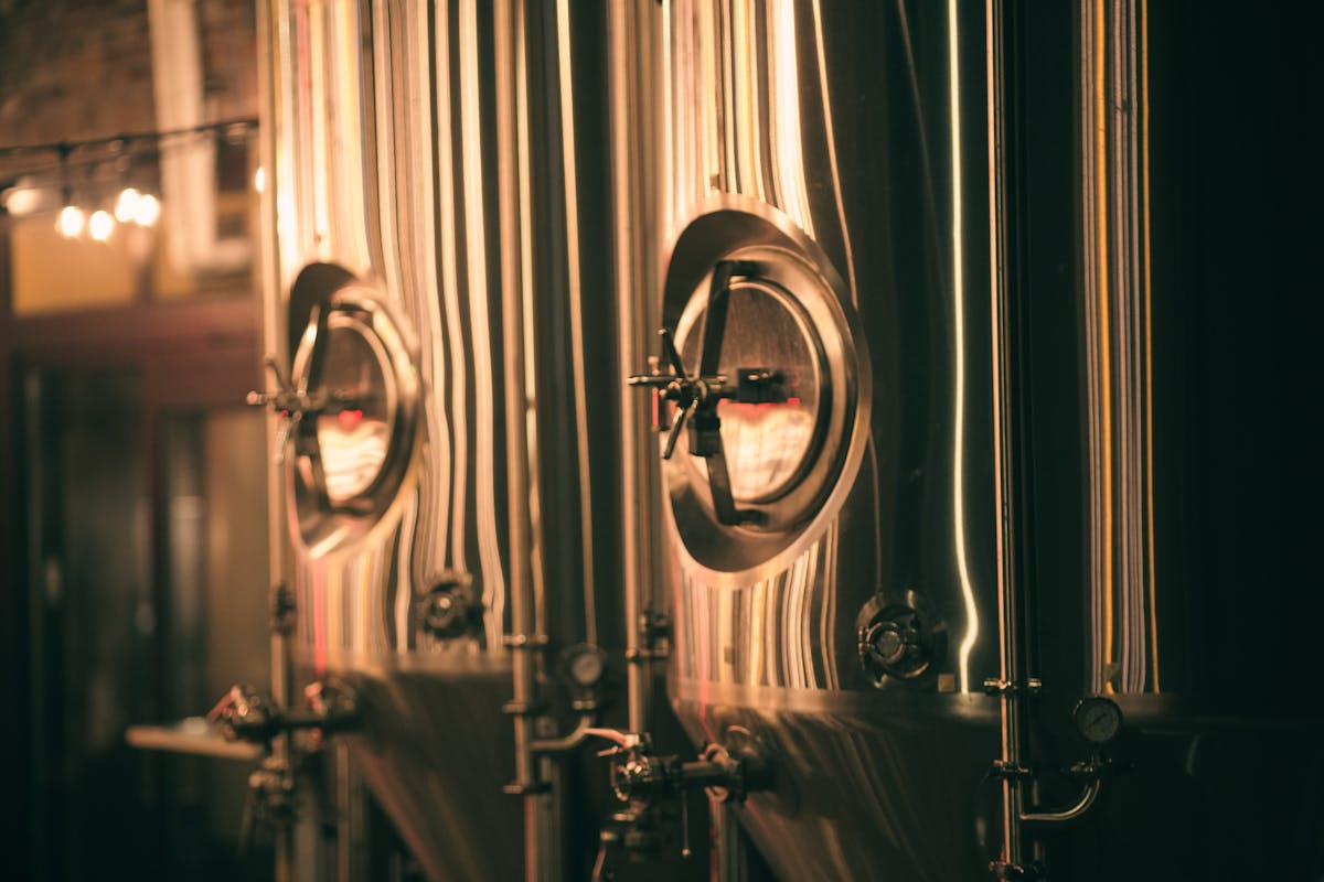 Stainless steel brewery tanks in an industrial brewing facility