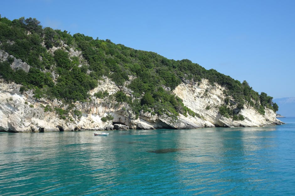 Coastal cliff with lush greenery and turquoise water in Zakynthos