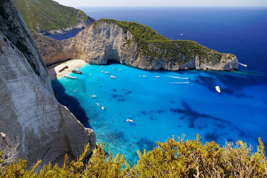 Overhead view of Navagio Beach with turquoise waters and sandy shore