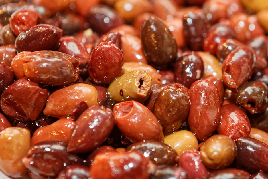 Close-up view of assorted shiny olives highlighting texture