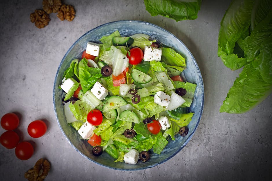 Top-down view of a vibrant Greek salad with fresh vegetables and feta cheese