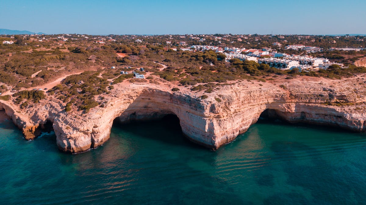 Aerial view of Benagil Cave and coastal cliffs in Algarve Portugal