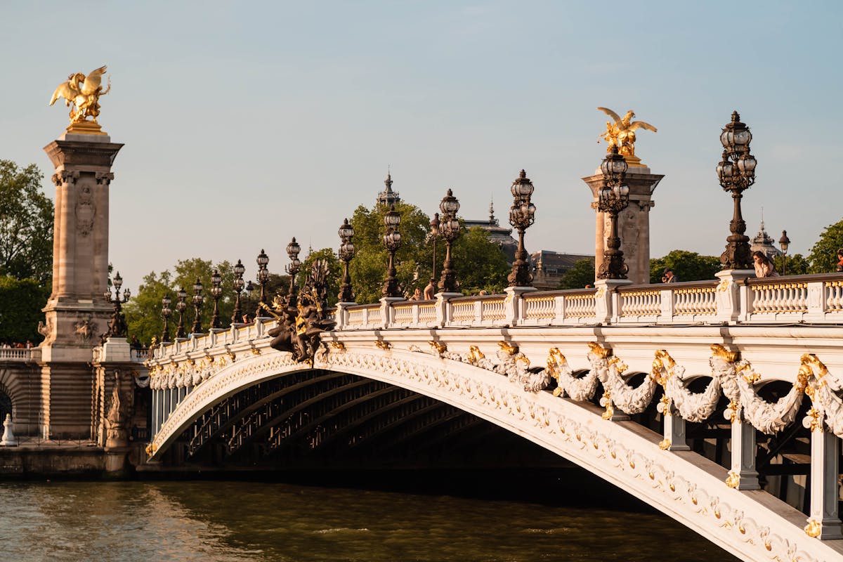 Golden statues on Pont Alexandre III bridge over the Seine River in Paris