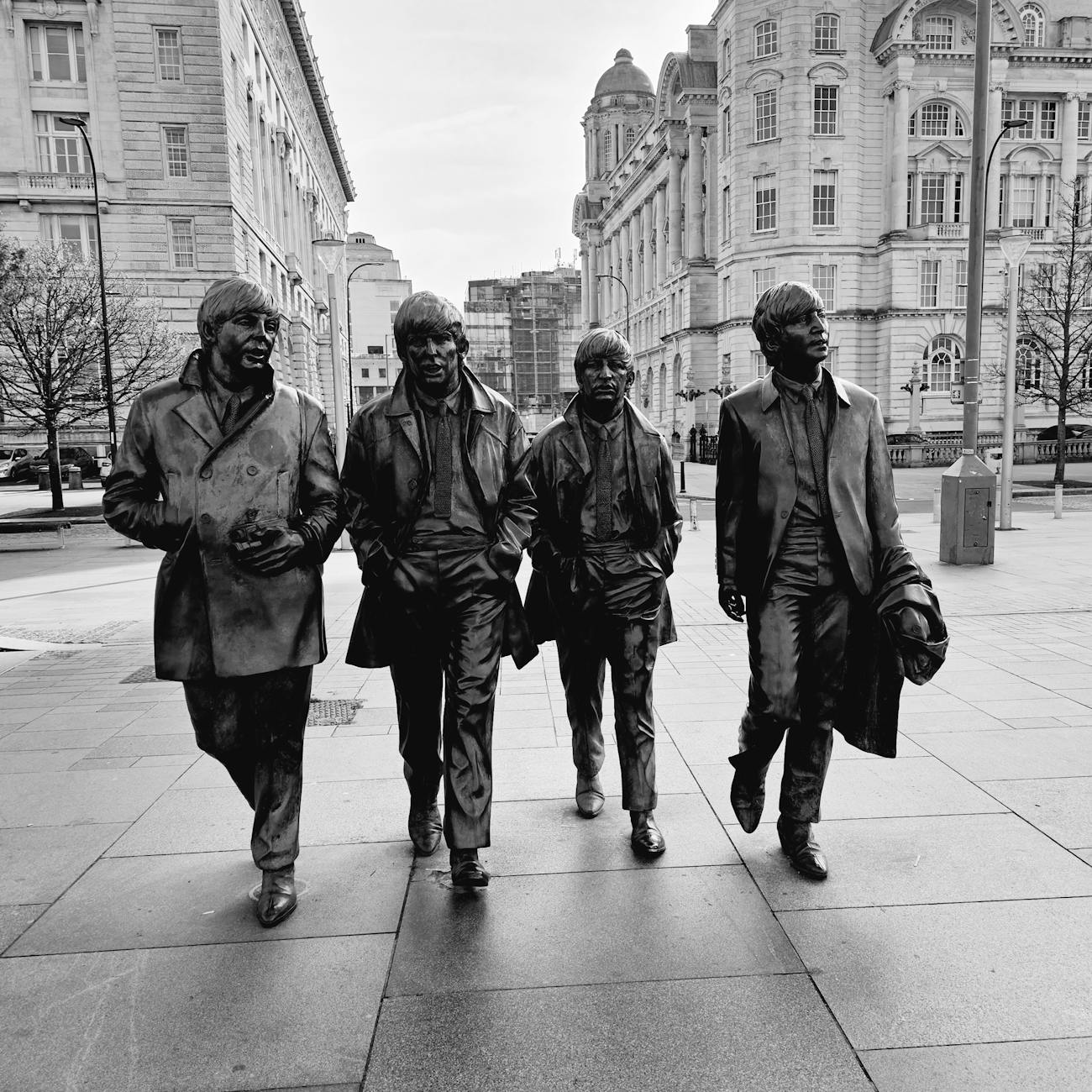 The Beatles statue sculpture in black and white, iconic music landmark