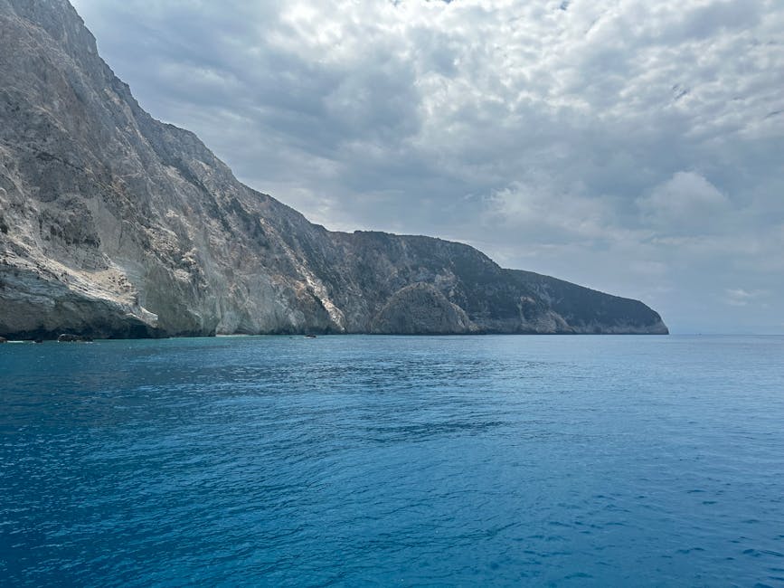 Majestic cliffs meeting turquoise waters in the Ionian