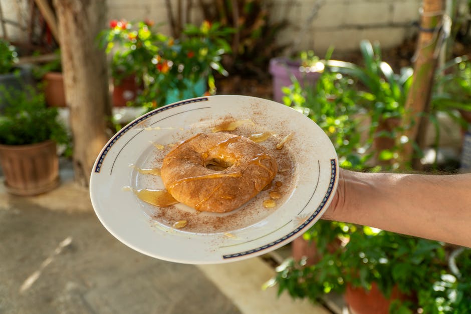 Sweet tiganopsomo topped with honey shot outdoors in Greece