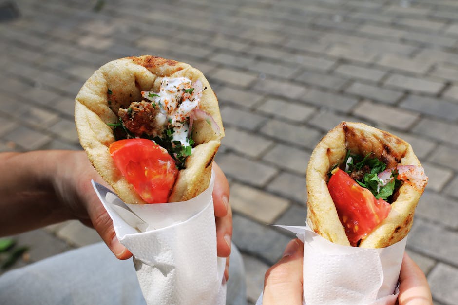 Two fresh gyros with tomato and herbs, perfect Greek street food