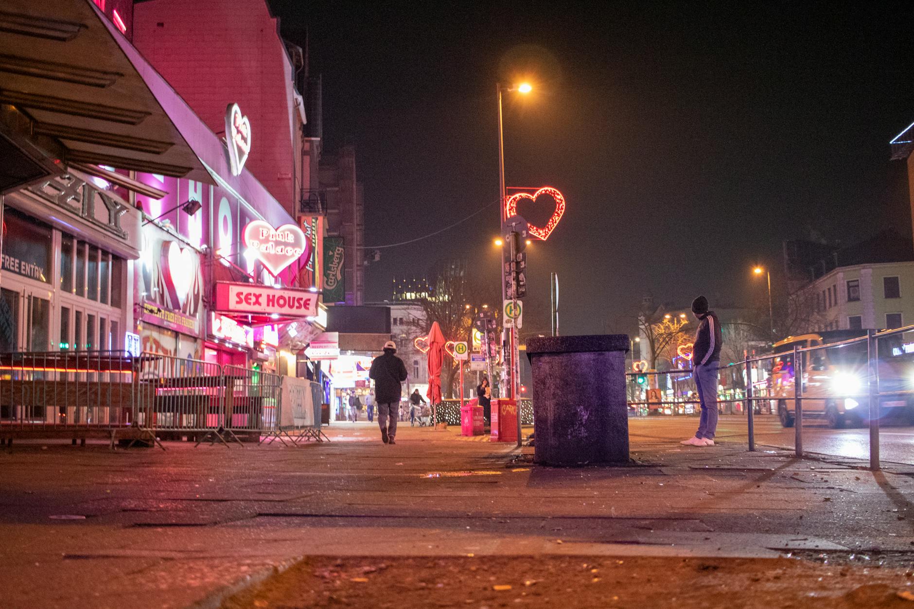 Hamburg Reeperbahn district at night with illuminated signs and entertainment venues