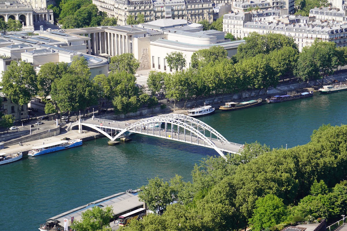 Aerial view of the Seine River and bridge highlighting Parisian city architecture