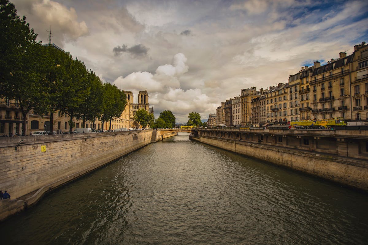 Seine River in Paris with Notre-Dame Cathedral and classic architecture along the banks