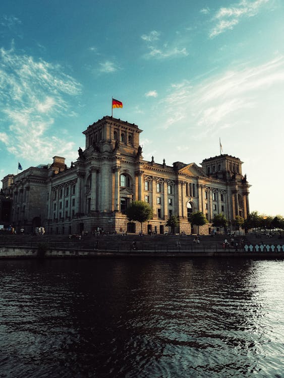 Reichstag Building reflecting in the Spree River at twilight Berlin