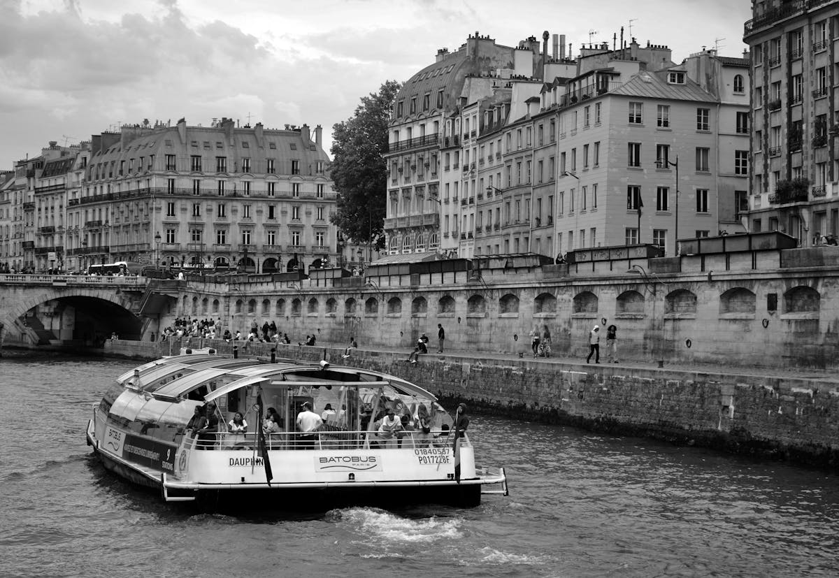 Batobus boat on the Seine with classic Parisian buildings in the background