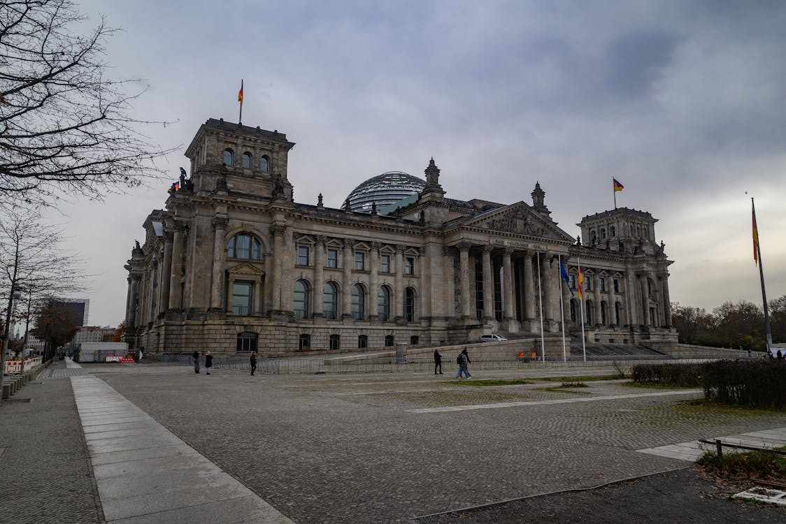 Exterior of the Reichstag Building in Berlin under cloudy sky