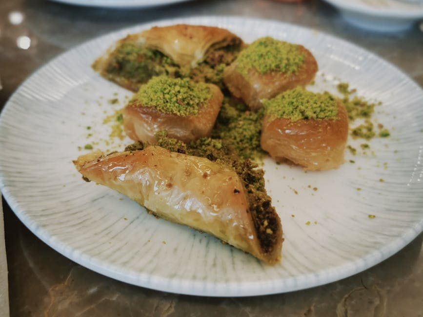Traditional baklava with pistachios on a white plate