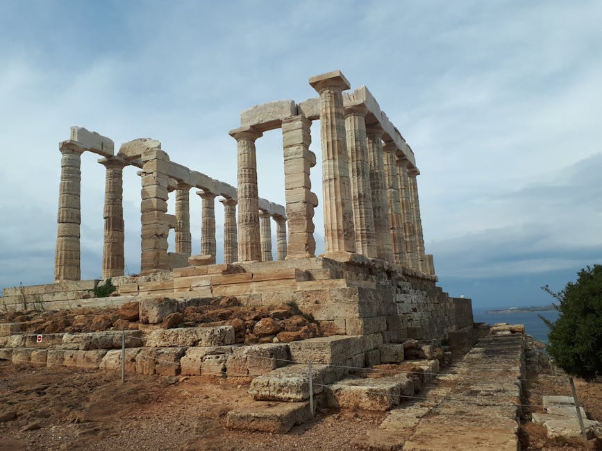 Ruined stone building with columns against a blue sky