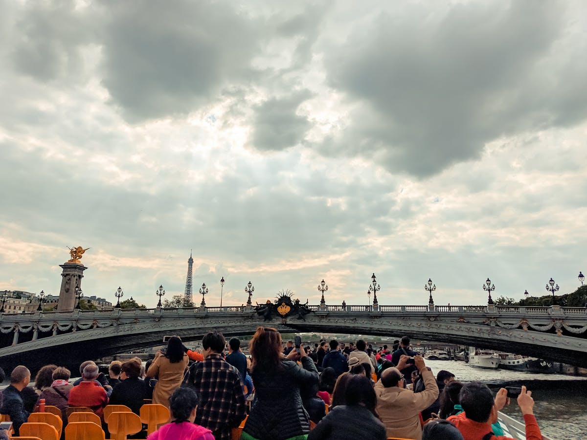 Boat cruise view of Pont Alexandre III with the Eiffel Tower in the background