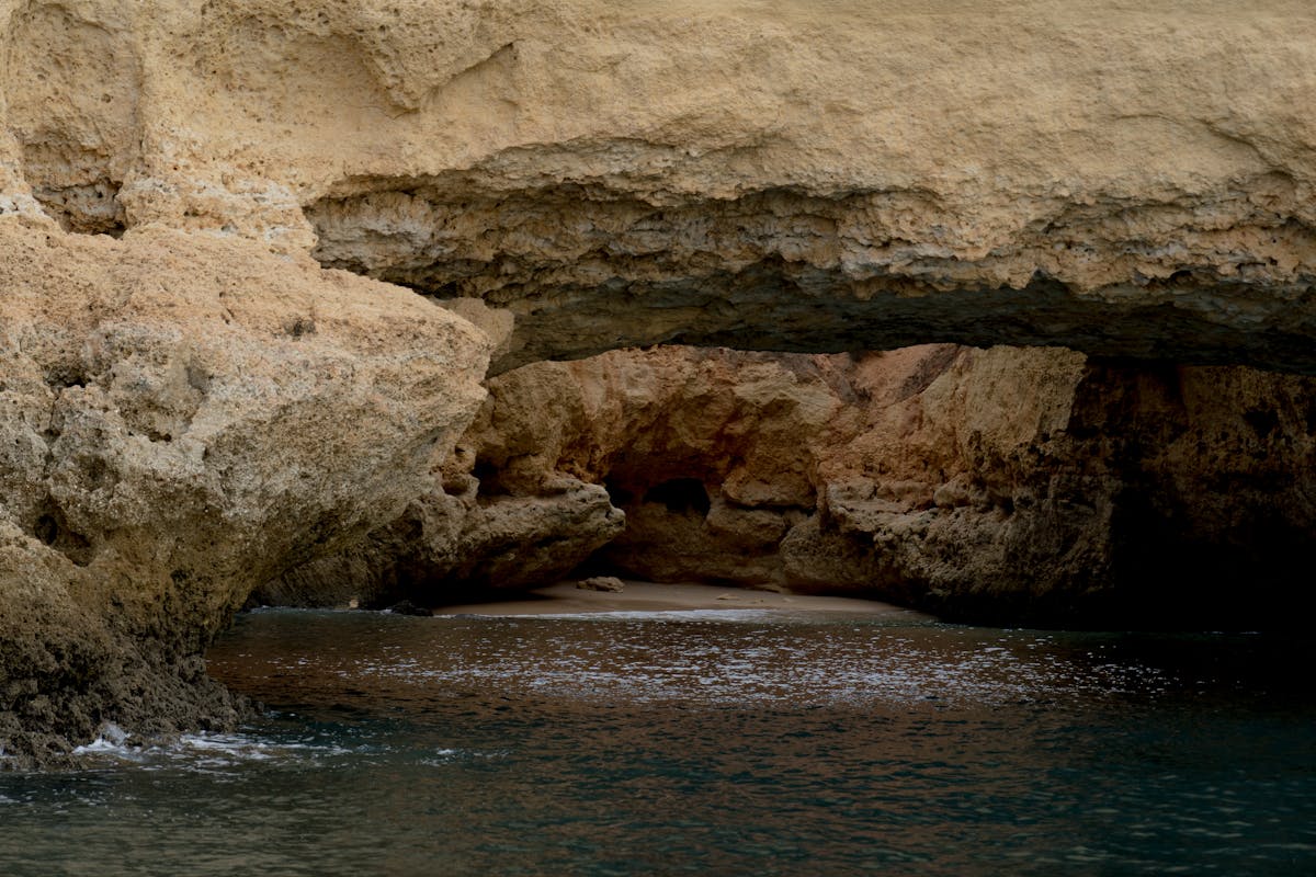 Beautiful rock formation with a natural archway by the sea in Portugal
