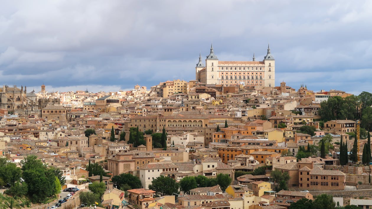 Aerial view of Toledo Spain featuring the historic Alcazar amid the cityscape