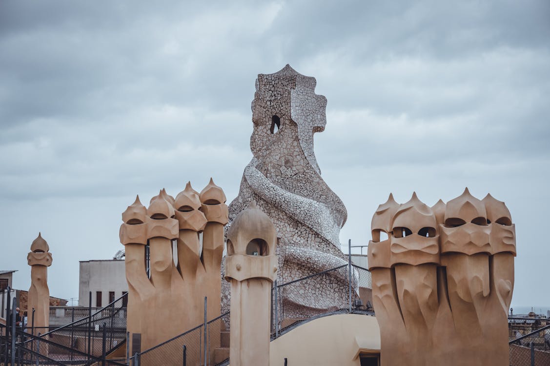 Artistic view of Casa Mila iconic rooftop chimneys in Barcelona showcasing Gaudi architecture