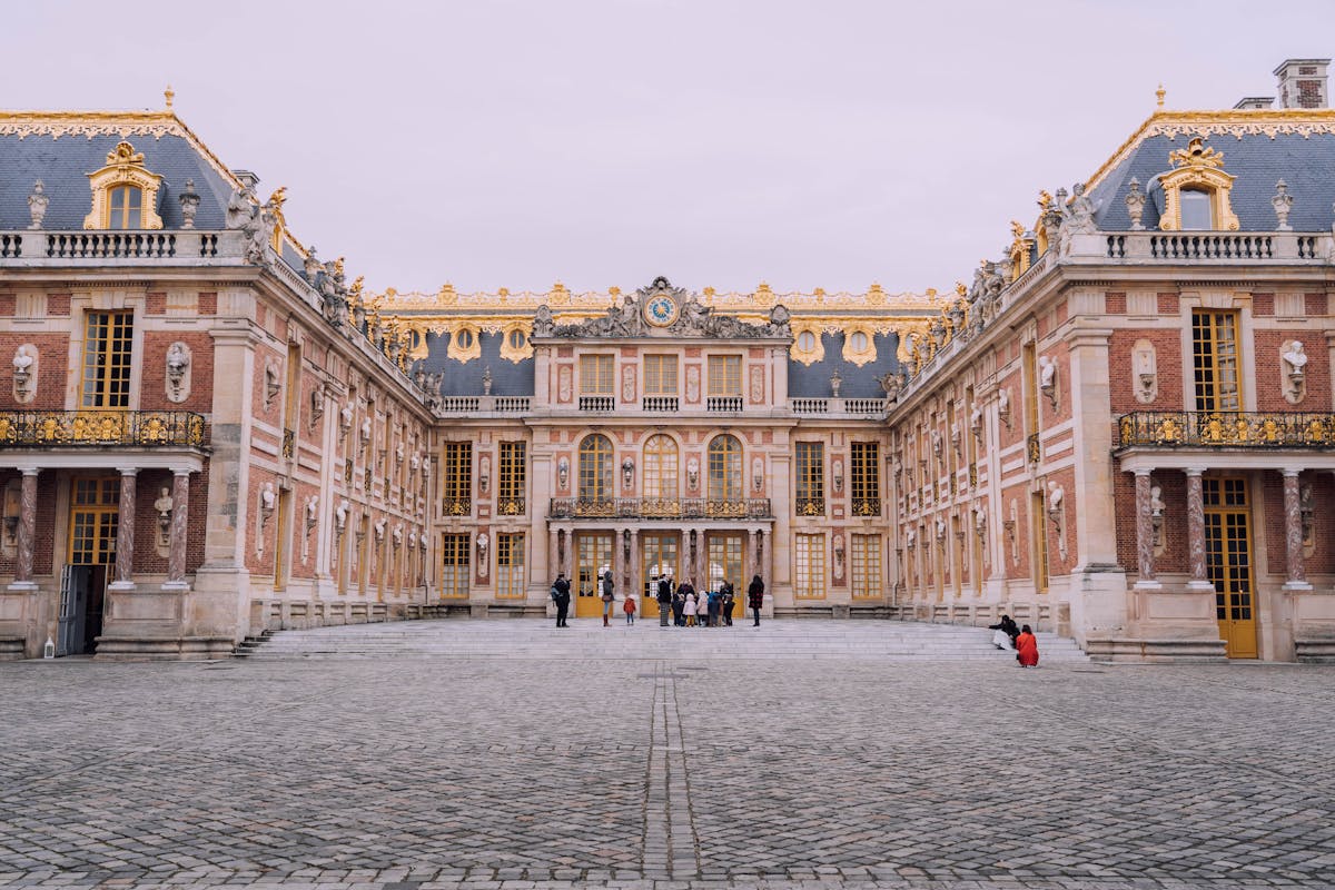 Courtyard view of the Palace of Versailles with the Royal Chapel visible